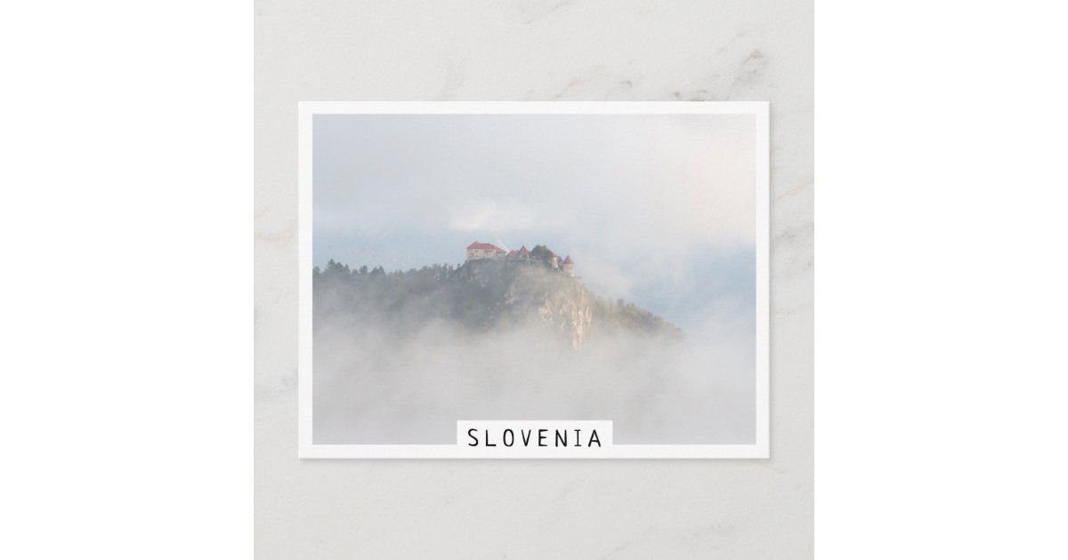 Bled castle surrounded by clouds postcard | Zazzle