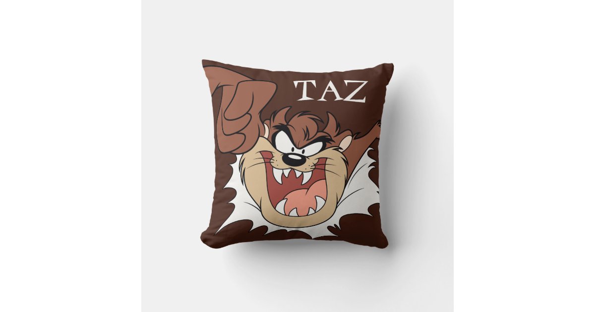 TAZ™ Bursting Through Page Cushion | Zazzle
